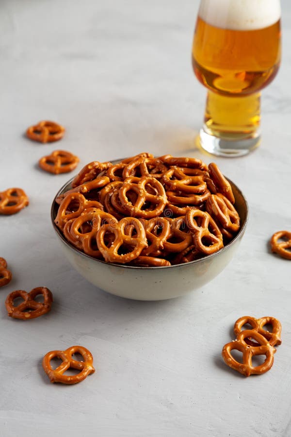 Mini Pretzels with Salt in a Bowl on a Gray Background, Side View Stock ...