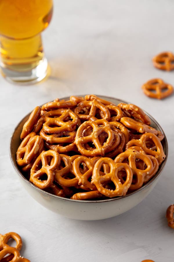 Mini Pretzels with Salt in a Bowl on a Gray Background, Side View Stock ...