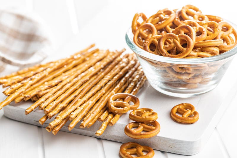 Mini Pretzels and Salted Sticks. Crusty Salted Snack on Cutting Board ...
