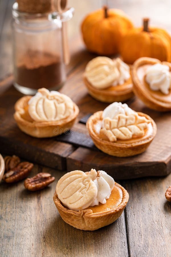 Mini Pumpkin Pies with Pumpkin and Fall Leaves Decoration Stock Image ...