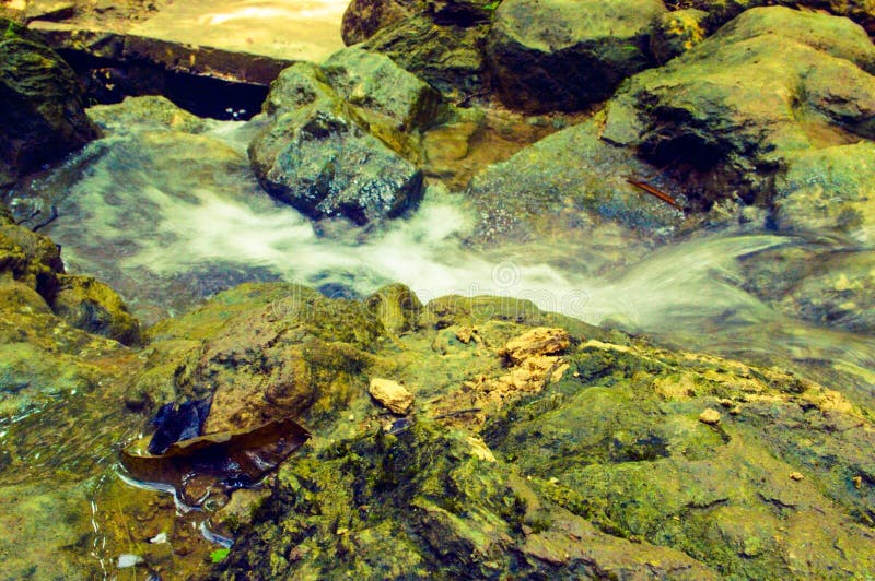 Mini river on green rock stock image. Image of rock, waterfall - 74328143