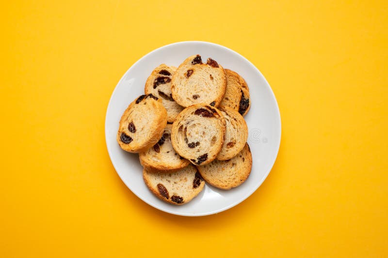 Mini Round Toasts of Bread with Raisins on Dish Stock Photo - Image of ...