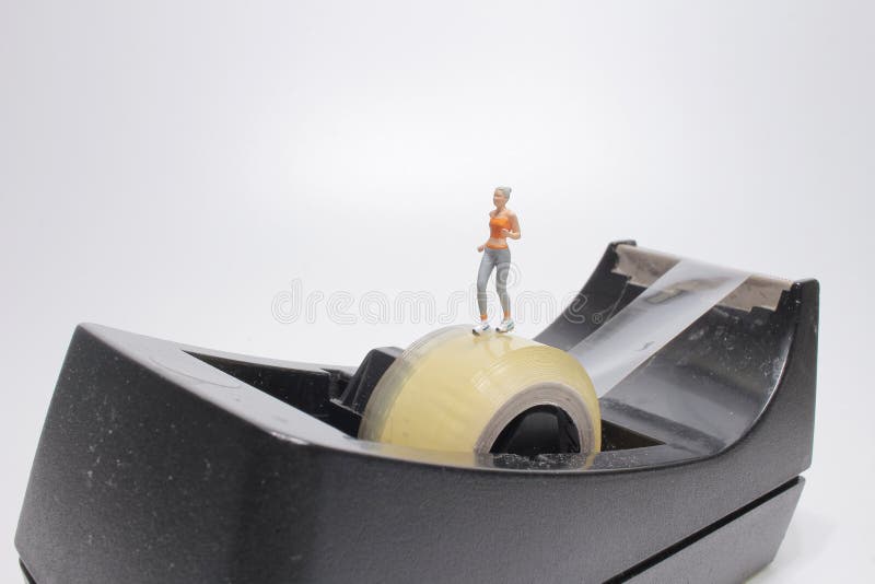 A Mini Running Figure on Tape Holder Stock Image - Image of workout ...