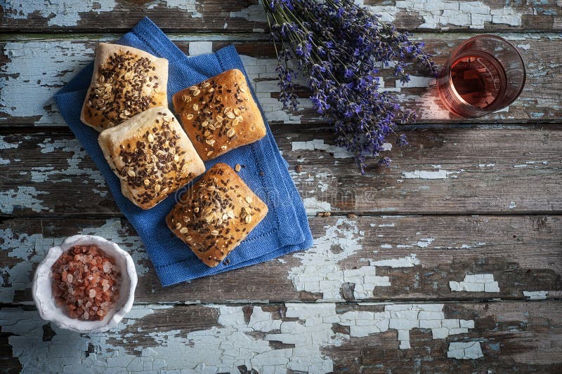 Mini Rustic Bread with Himalayan Salt and Rose Wine on a Old Table ...
