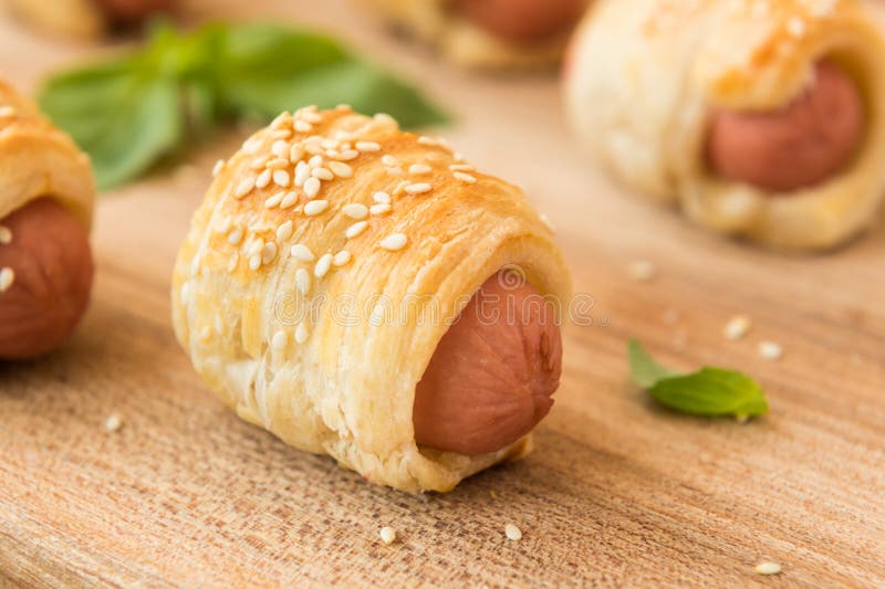 Mini Sausage Wrapped in Puff Pastry Stock Photo - Image of green ...