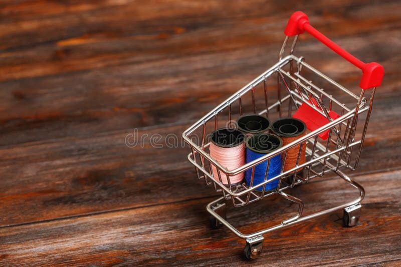 Mini Shopping Cart with Thread Spools Concept Stock Photo - Image of ...