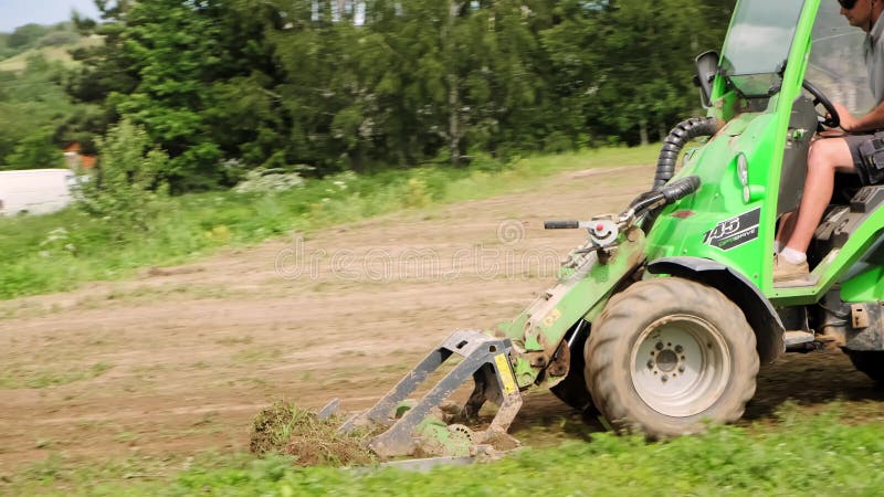 Mini Skid Steer Loader Clear the Construction Site. Land Work. Small ...