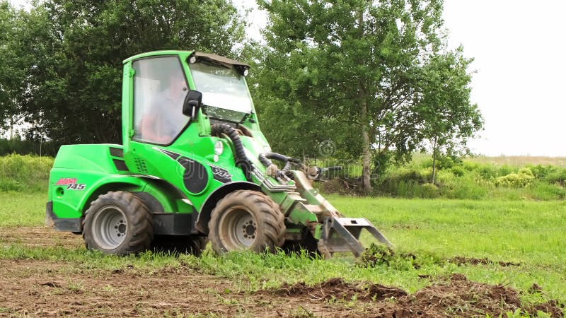 Mini Skid Steer Loader Clear the Construction Site. Land Work. Small ...