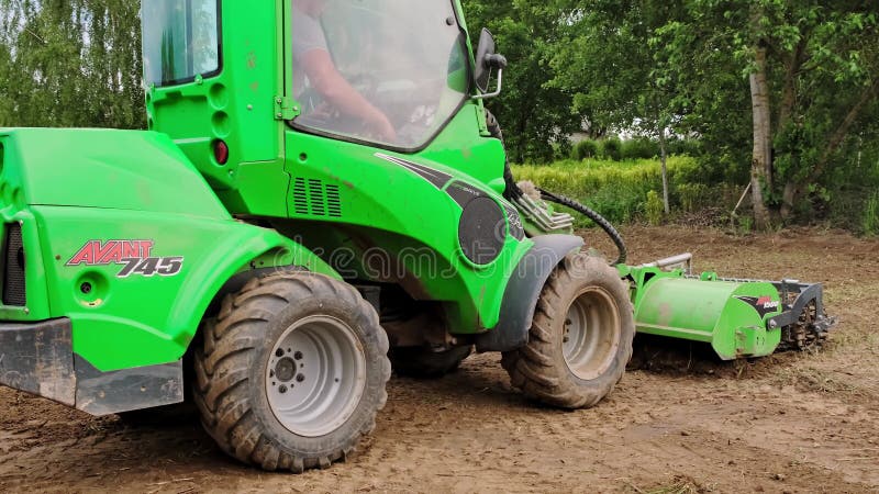 Mini Skid Steer Loader Clear the Construction Site. Land Work. Small ...