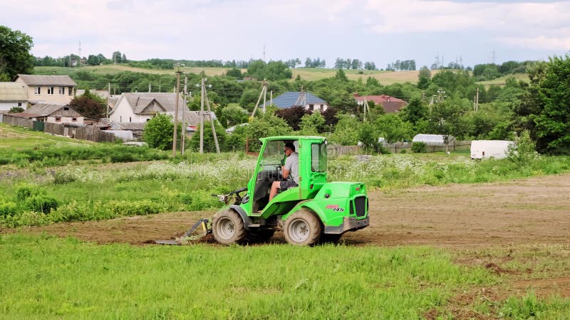 Mini Skid Steer Loader Clear Construction Site. Land Work. Small ...