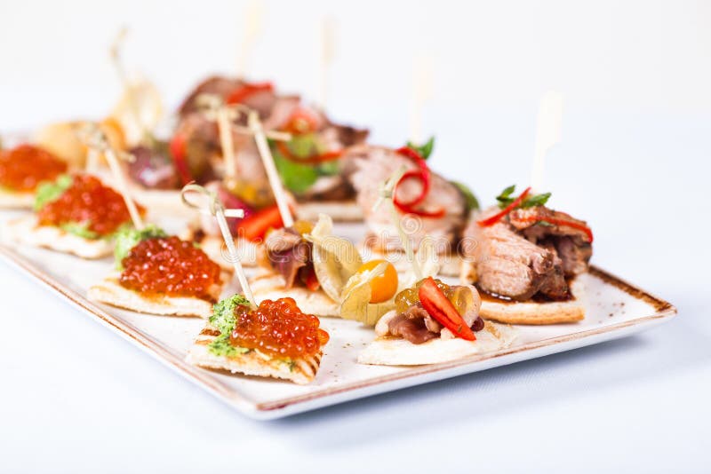 Mini Snacks Tapas with Caviar and Meat on White Plate Stock Image ...