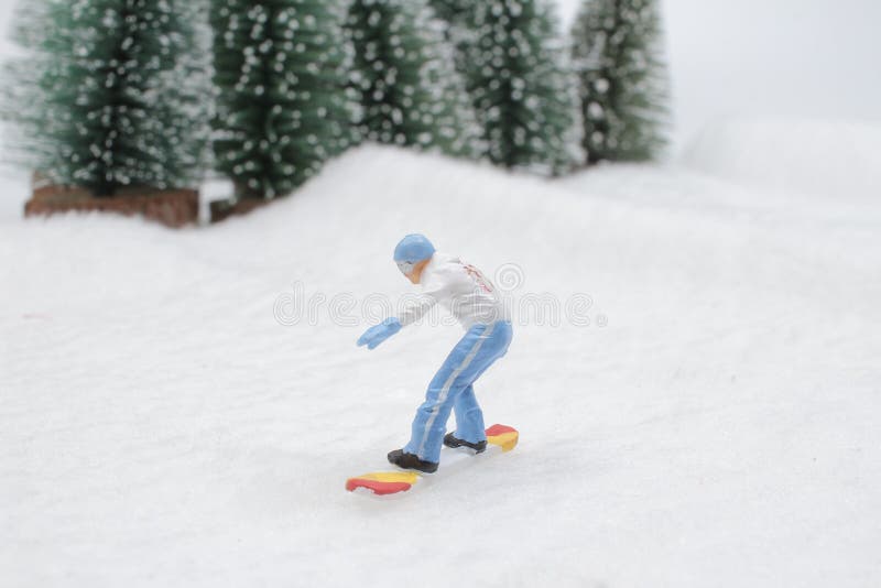 A Mini Snowboarding Sportsman in Snow Action and Motion Stock Photo ...