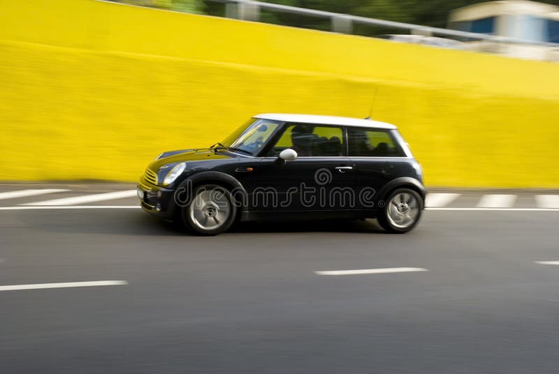 Speeding car (Mini Cooper) stock image. Image of commuting - 14508305