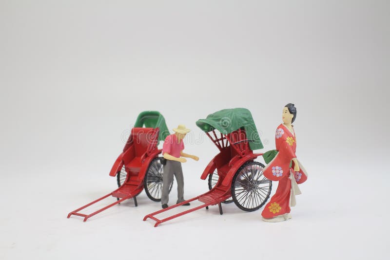 A Mini Statue and Red Vintage Oriental Rickshaw Cab Stock Photo - Image ...
