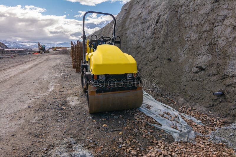 A Mini Steamroller at a Road Construction Site Editorial Image - Image ...