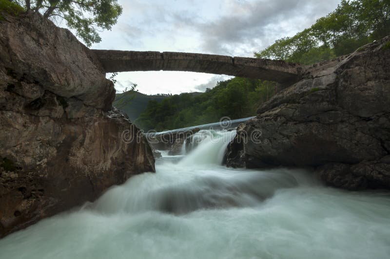 Mini Stone Bridge Over a Waterfall Stock Photo - Image of rock, river ...