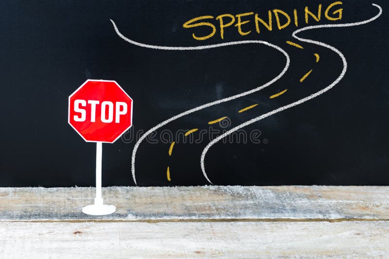 Mini STOP Sign on the Road To SPENDING Stock Photo - Image of wooden ...