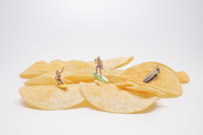 A Mini of Surfer , Surfing on Potato Chip Stock Photo - Image of ...