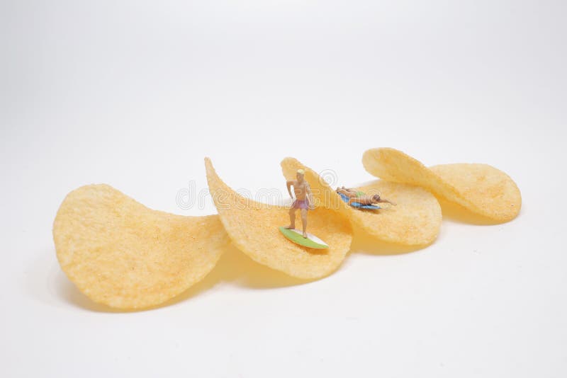 A Mini of Surfer , Surfing on Potato Chip Stock Image - Image of crisps ...