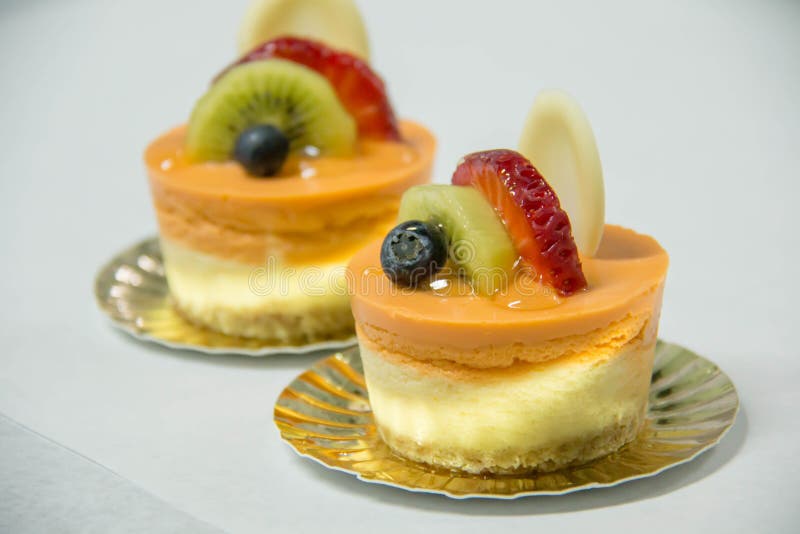 Mini Thai Tea Cheese Cake with Fruit on Top Stock Photo - Image of ...