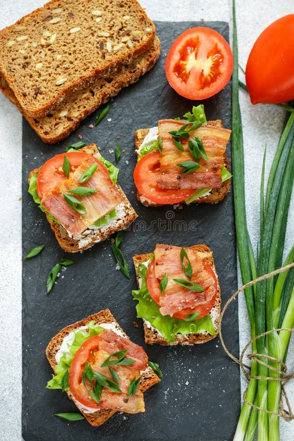 Mini Toast of Grain Bread with Tomatoes, Bacon, Lettuce and Green ...