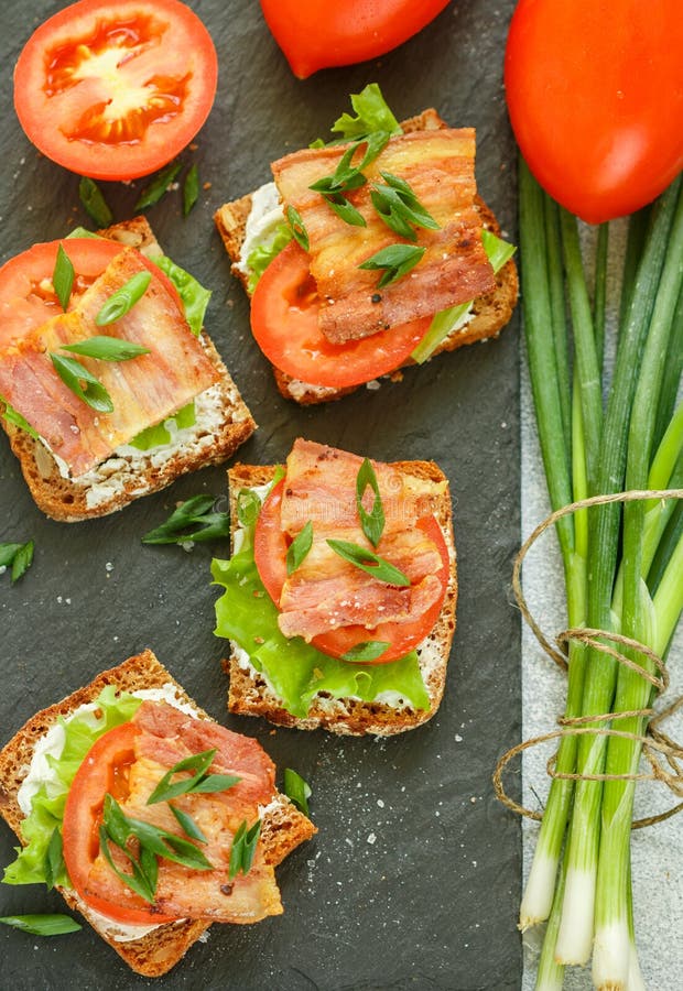 Mini Toast of Grain Bread with Tomatoes, Bacon, Lettuce and Green ...