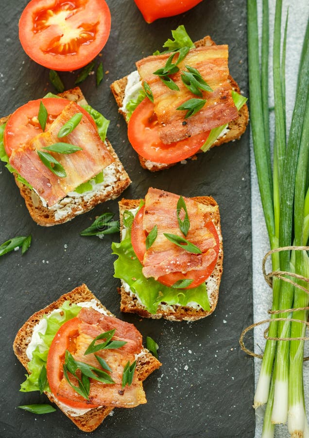 Mini Toast of Grain Bread with Tomatoes, Bacon, Lettuce and Green ...
