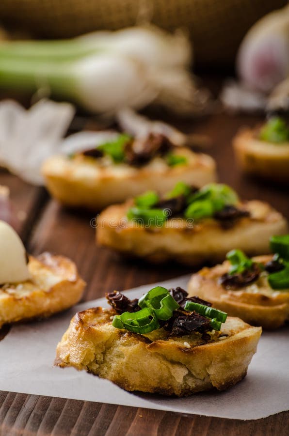 Mini Toasts with Garlic and Dried Tomato Stock Photo - Image of ...