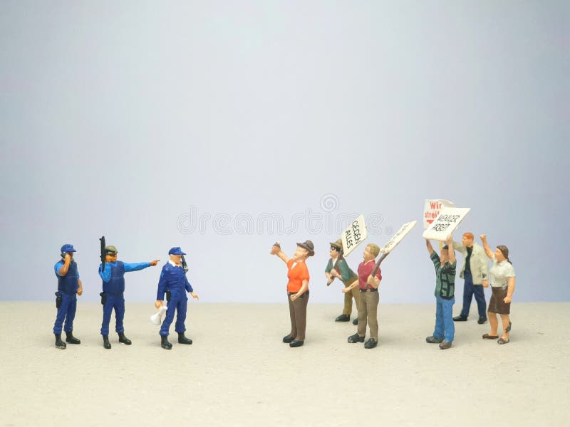 Mini Toy Figure of People at Table with Blurred Background. Crowd ...