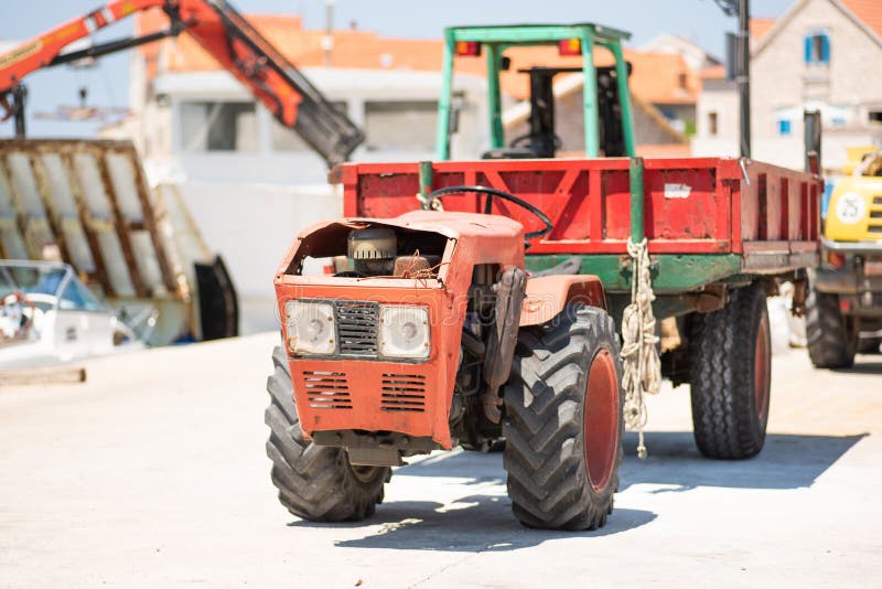 Mini Tractor Driving in the Street Stock Photo - Image of driving ...