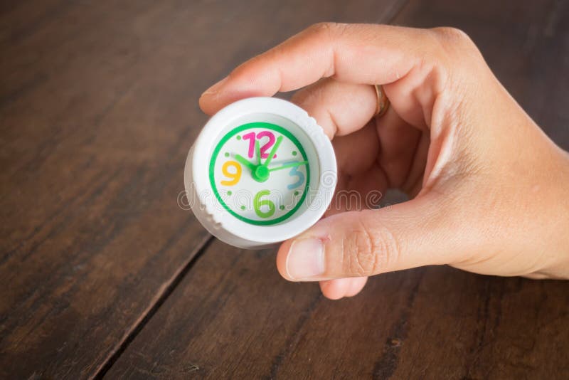 Mini white clock in hand stock photo. Image of countdown - 85471084