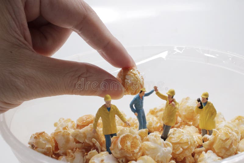 A Mini Worker Figure Face the Throw Popcorn Stock Photo - Image of ...