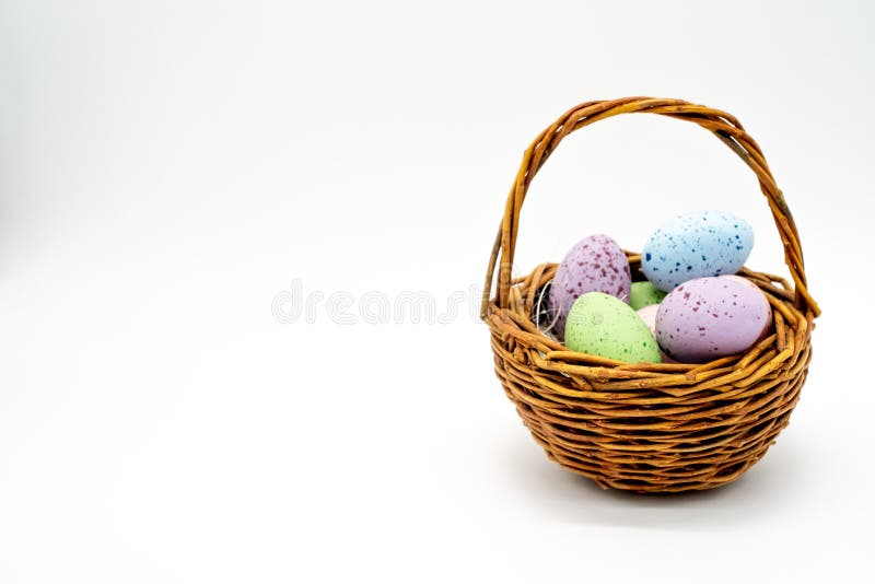 Mini Woven Easter Basket with Coloured Speckled Eggs Isolated on Stock ...