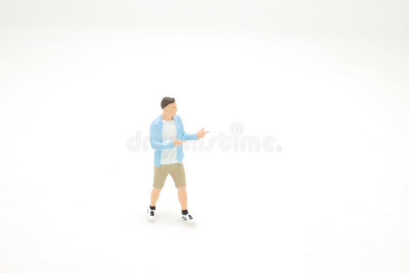 The Mini Young Figure with Beard Pointing Away Stock Image - Image of ...