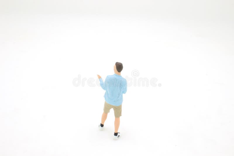The Mini Young Figure with Beard Pointing Away Stock Photo - Image of ...