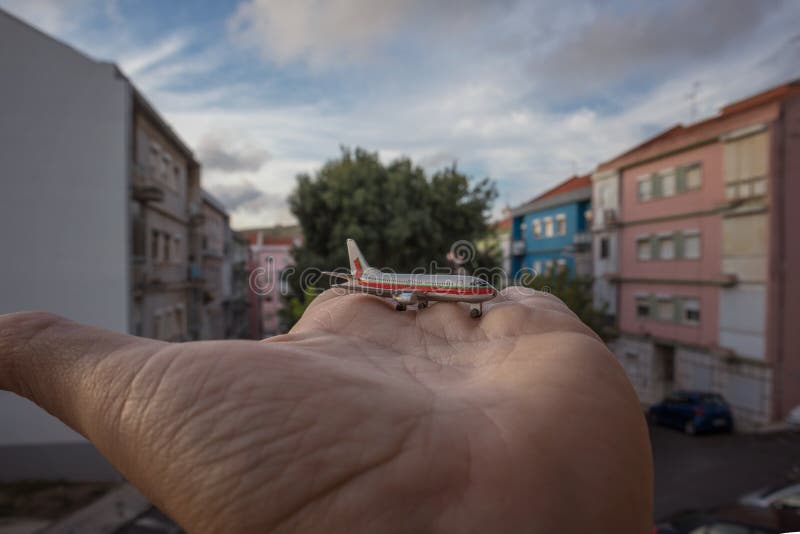 Miniature Airplane in Hand Palm Overlooking the City Stock Photo ...