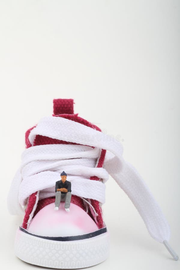 Miniature of a Boy Sitting on a Sneaker Stock Photo - Image of puppet ...