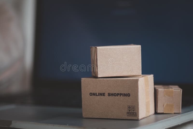 Miniature Brown Boxes on Computer Keyboard for Online Shopping Stock ...