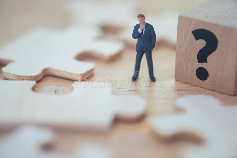 Miniature Businessman is Standing with Question Mark Stock Photo ...