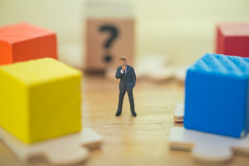Miniature Businessman Thinking and Standing with Question Mark. the ...