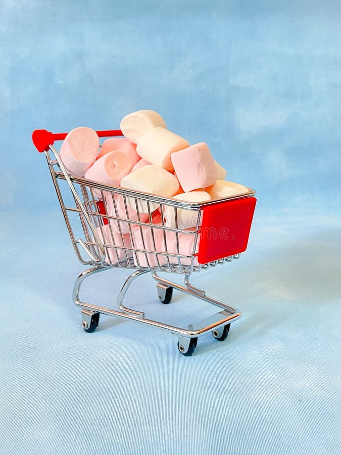 Miniature Cart from a Supermarket with Marshmallows. Blue Background ...