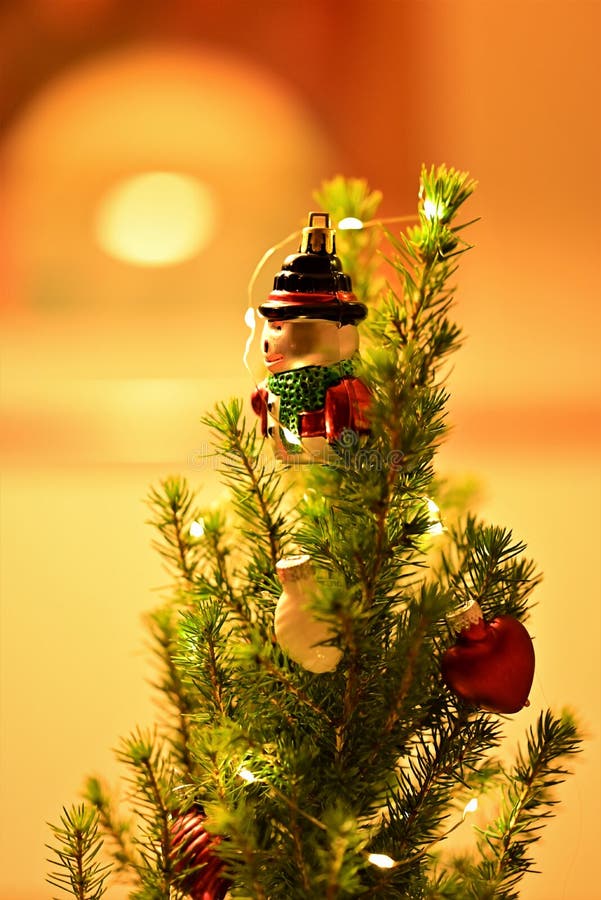 Miniature Christmas Tree Decorated with Bullets and a Figure Stock ...