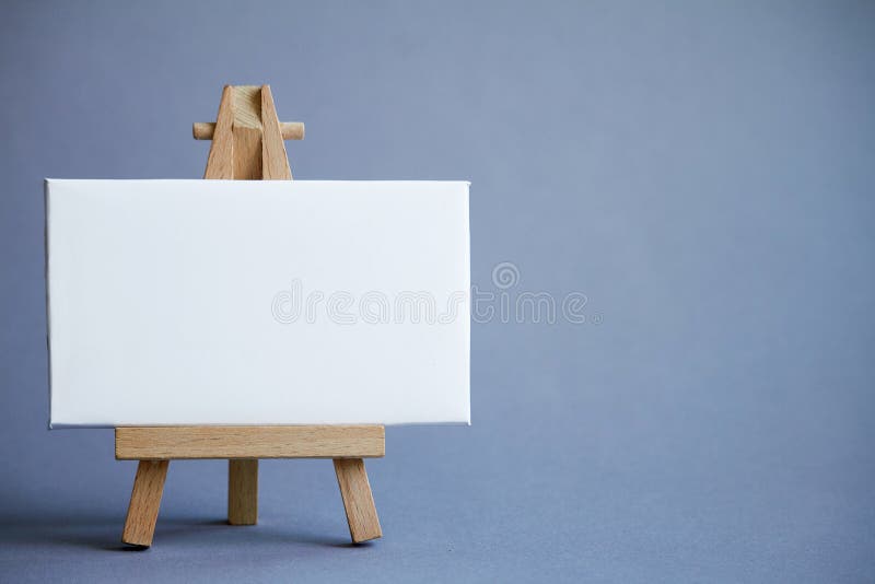 A Miniature Easel with a White Board for Writing, Pointer on White ...