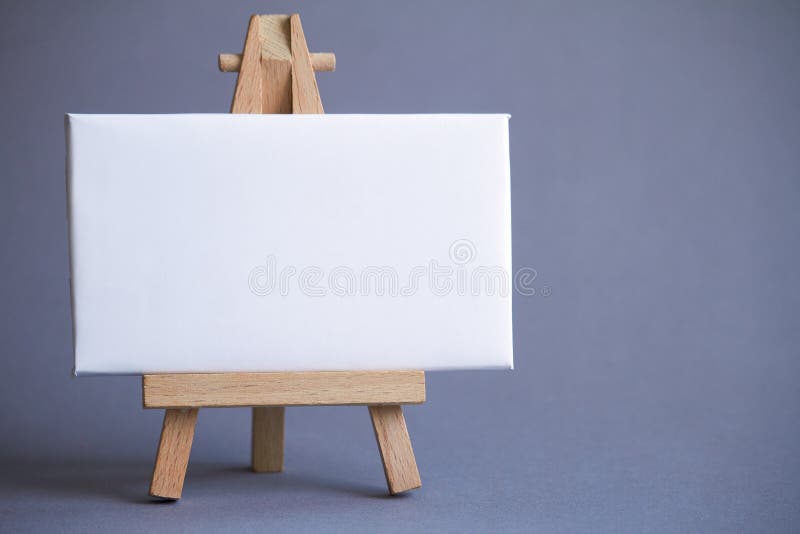 A Miniature Easel with a White Board for Writing, Pointer on White ...