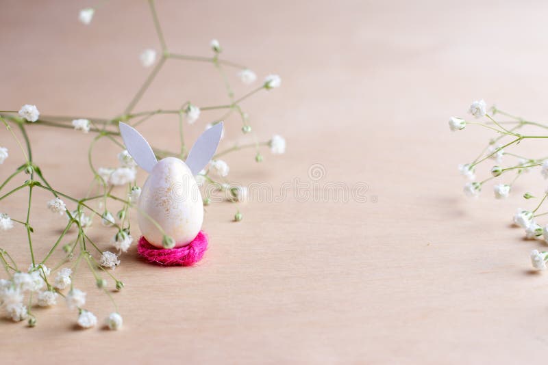 Miniature Egg in the Shape of a Rabbit on a Pink Stand Stock Image ...