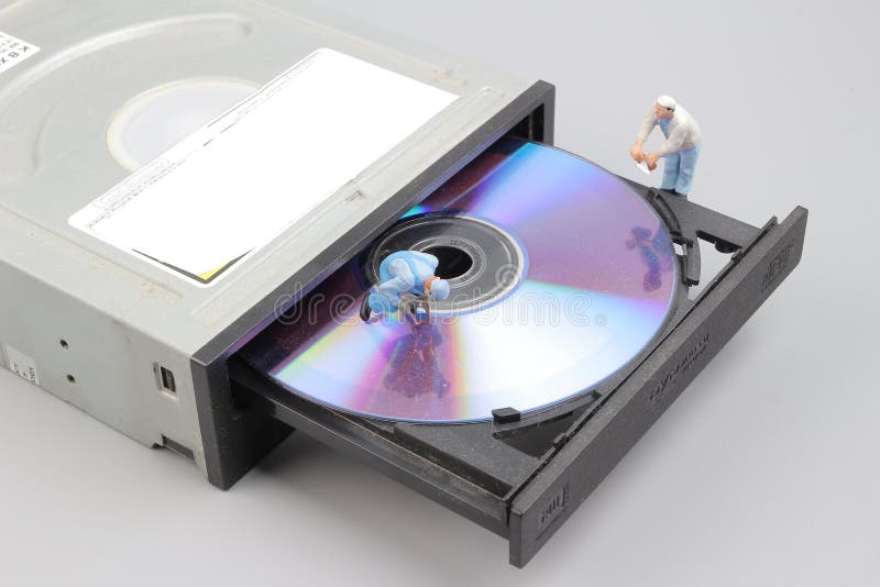 Miniature Engineer and Worker Fixed To Clean CD Rom Stock Photo - Image ...