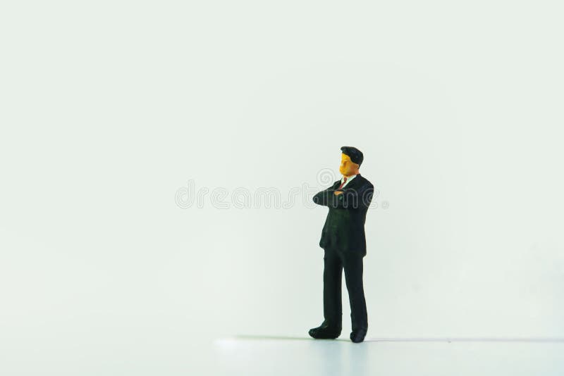 Miniature Figure of a Businessman Stock Photo - Image of work, pointing ...