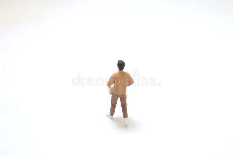 Miniature Figure Holding a Box on White Background Stock Photo - Image ...