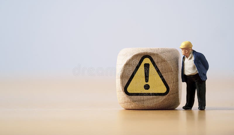 Miniature Figure of Senior Engineer Standing and See at Warning ...