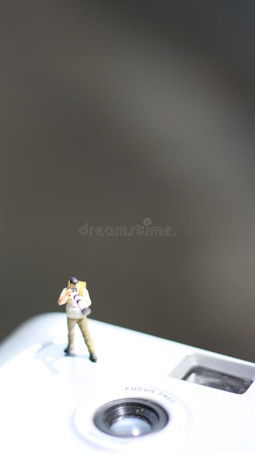 A Miniature Figure Taking Picture with a Camera Stock Image - Image of ...
